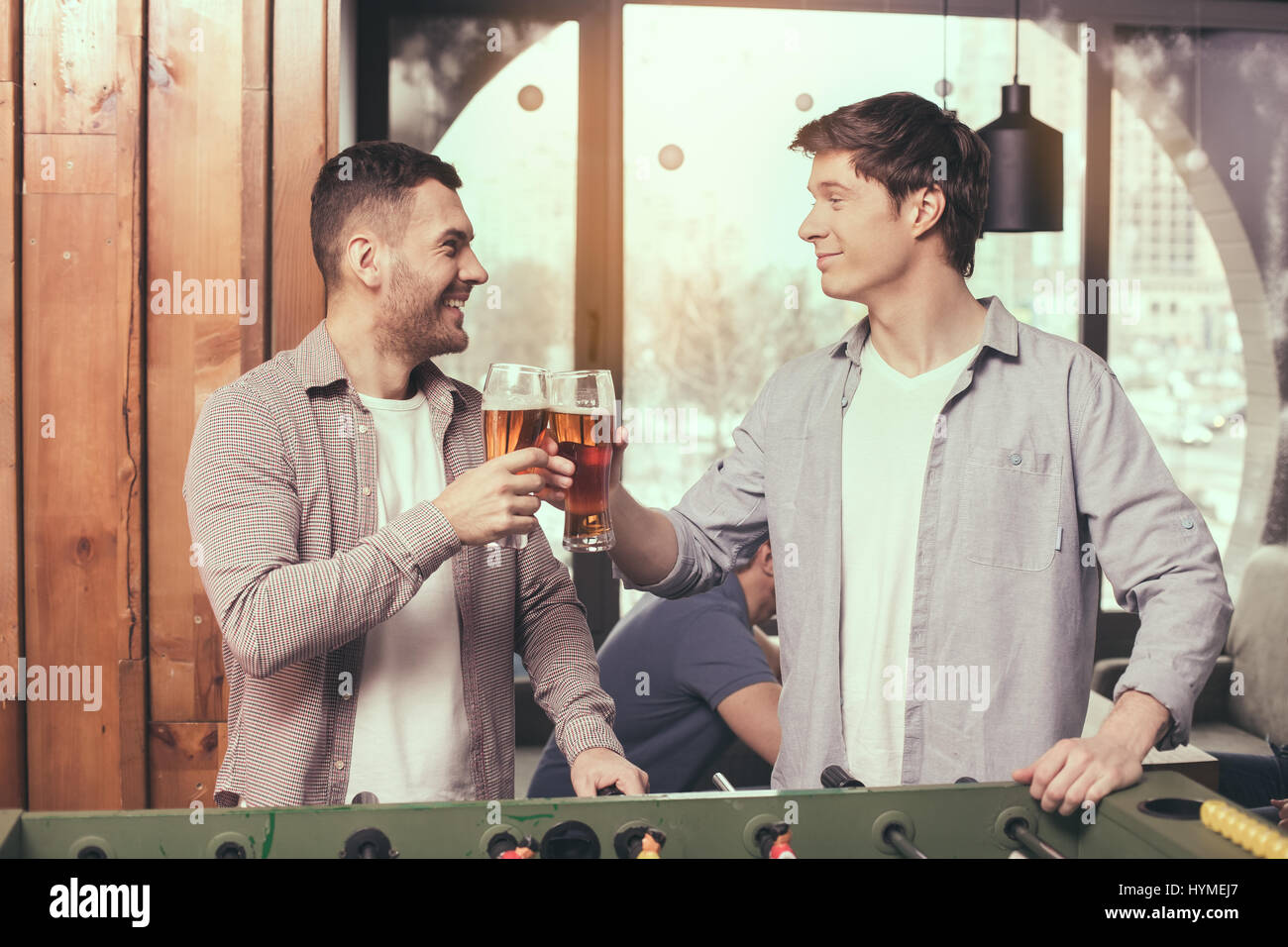 Friends having fun in pub Stock Photo - Alamy
