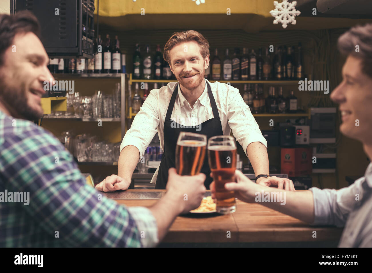Friends having fun in pub Stock Photo - Alamy