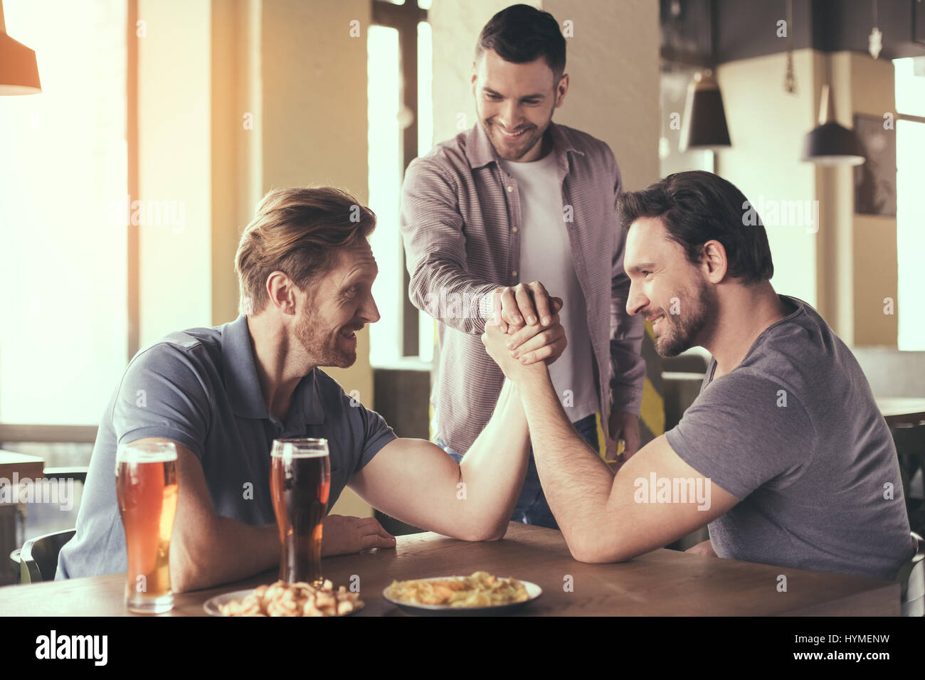Friends having fun in pub Stock Photo - Alamy