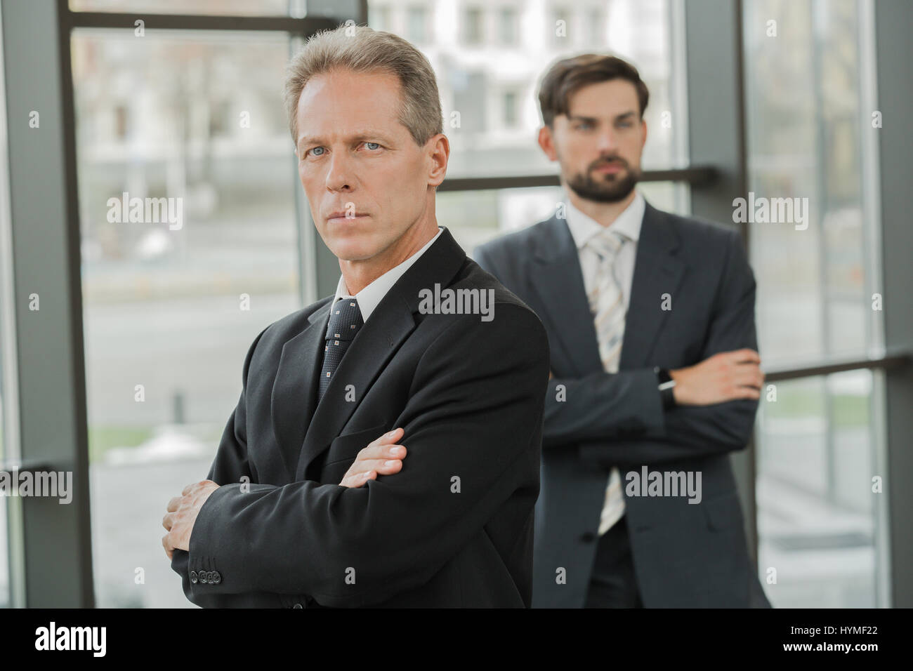 Stylish businessmen working in office Stock Photo - Alamy