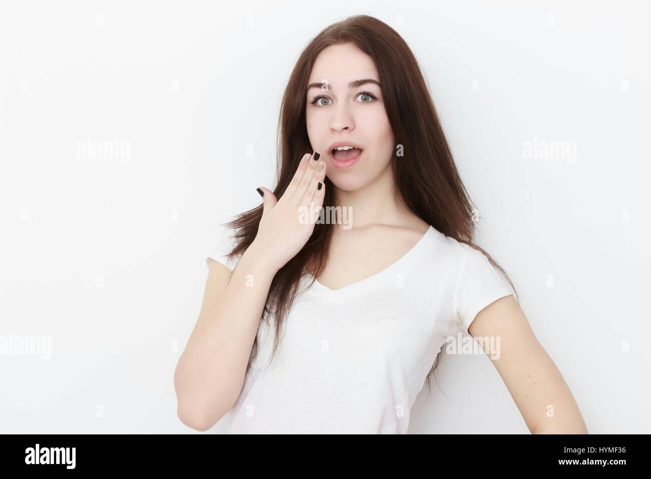Young casual woman In pink blouse isolated over white background studio ...