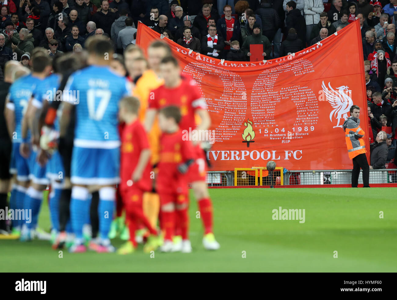 Players in front of a flag in memory of the Hillsborough disaster ...