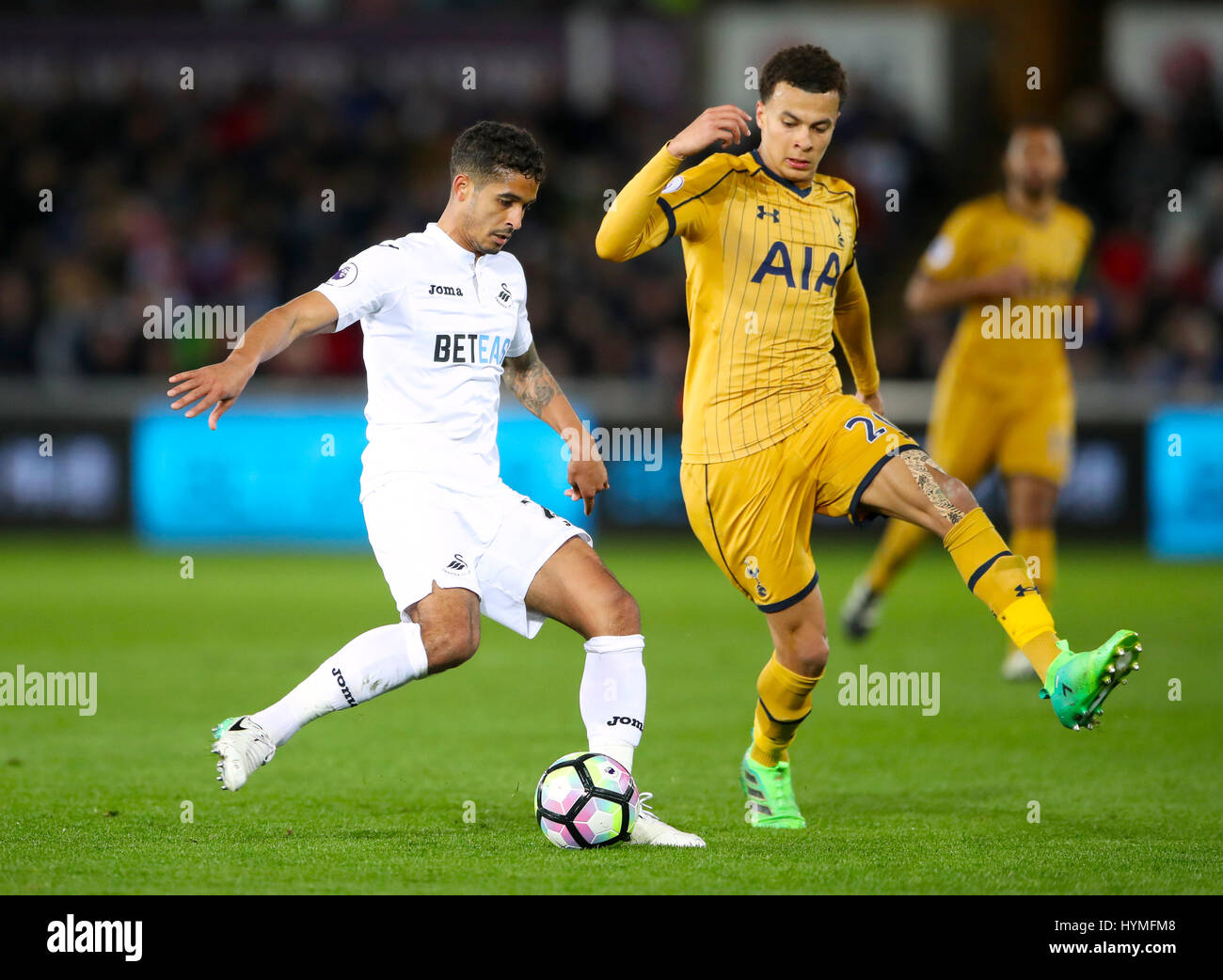 Swansea City's Kyle Naughton (left) and Tottenham Hotspur's Dele Alli ...