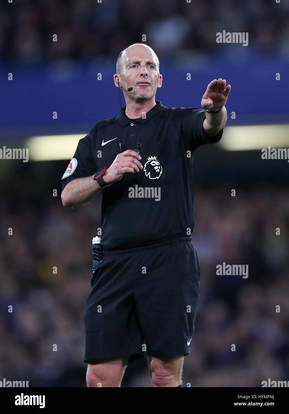 Referee Mike Dean during the Premier League match at Stamford Bridge ...