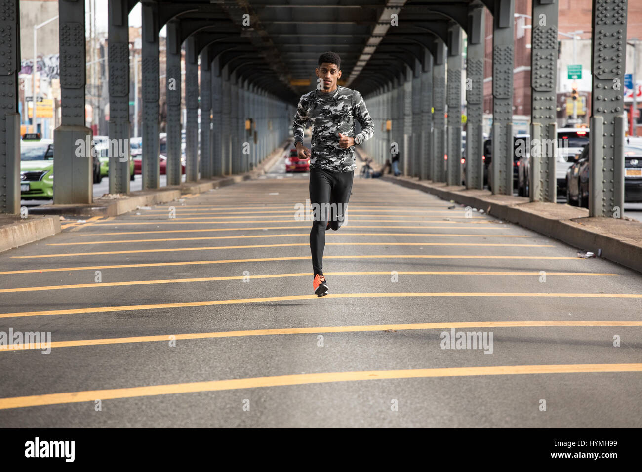A young man goes for a jog in Brooklyn, New York City. Shot during the ...