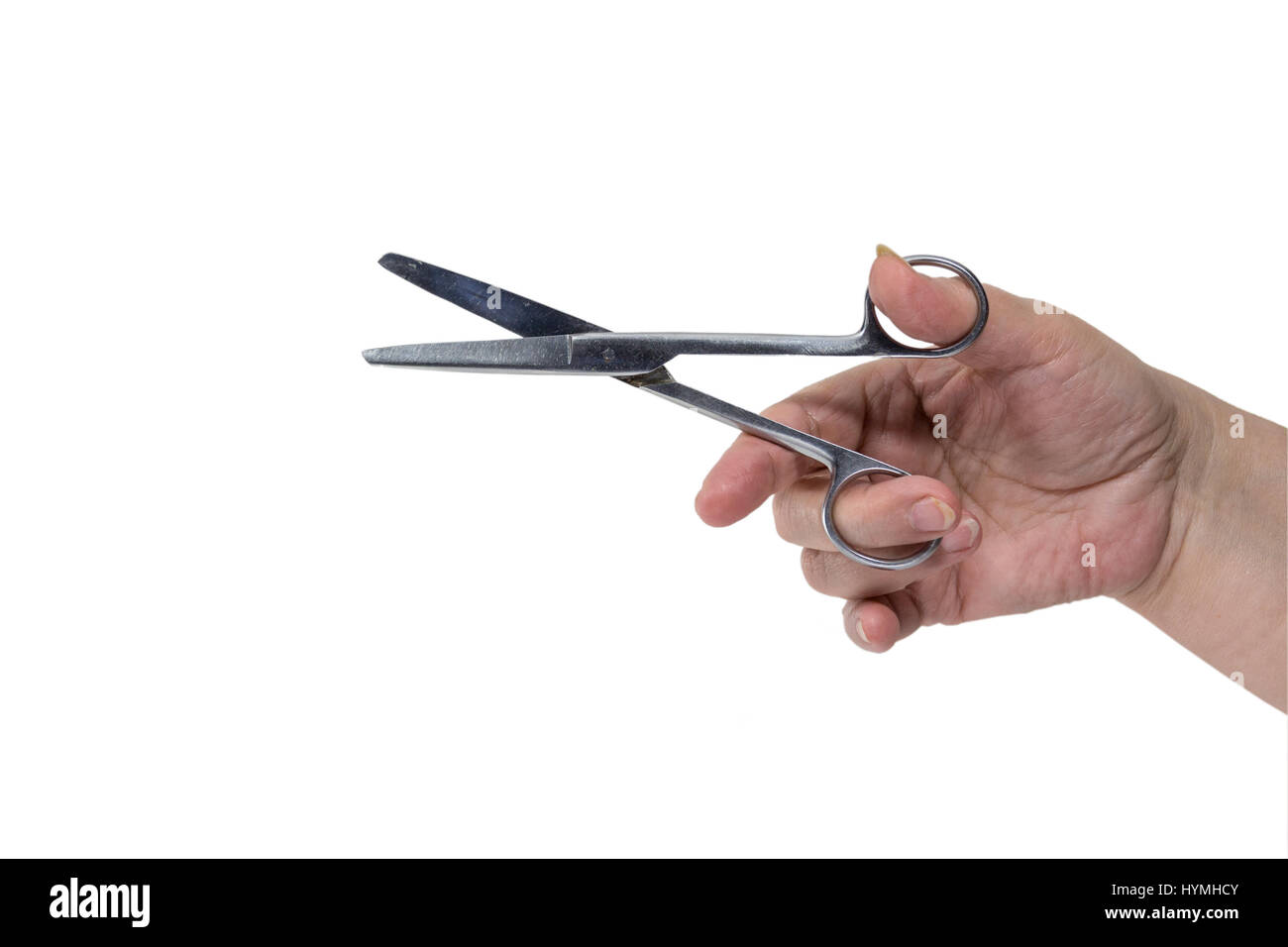 Senior woman's hand keeps scissors isolated on white background Stock ...
