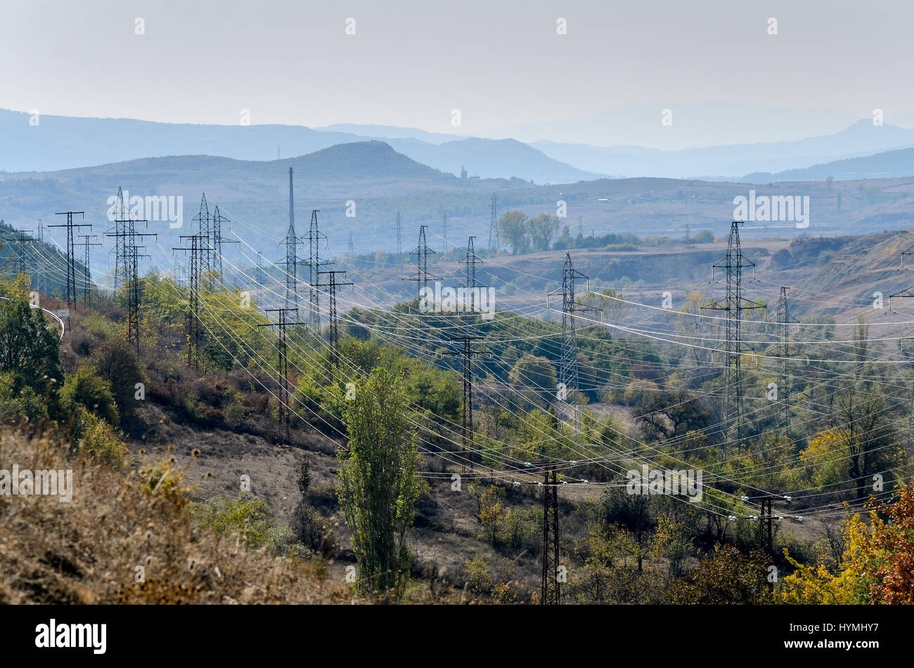 Overhead power lines in a valley Stock Photo - Alamy