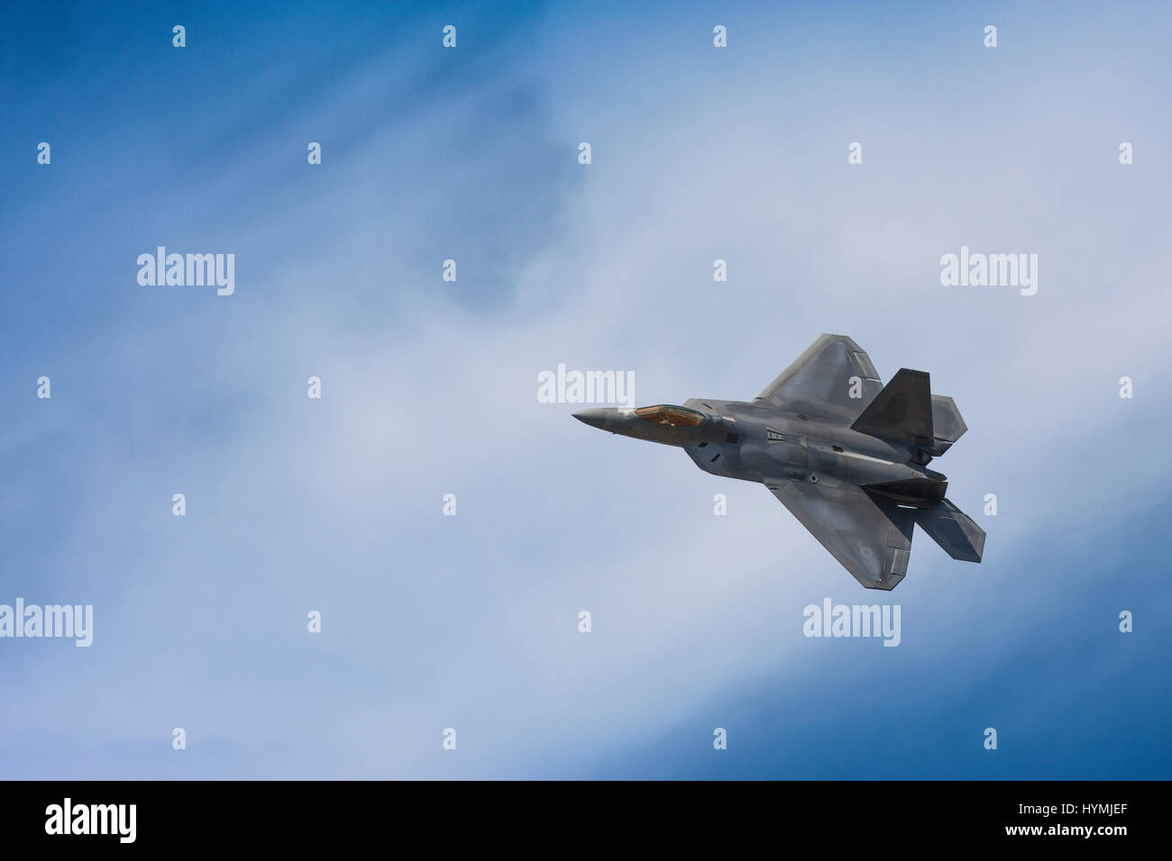 Lockheed Martin F-22 Raptor in flight, turning, sky, copyspace Stock ...