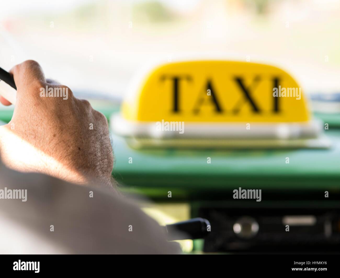Close up picture of Cuban Taxi driver driving through the Malecon in ...