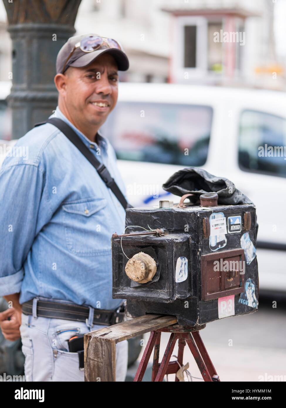 Cuban man posing in front of his handmade large format camera in ...