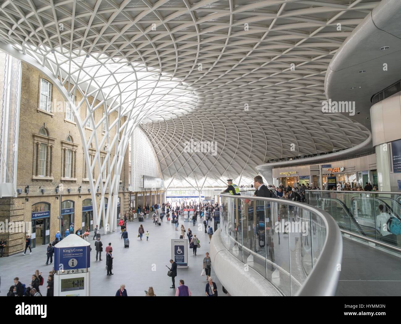 Travellers And Commuters In Kings Cross Railway Station London