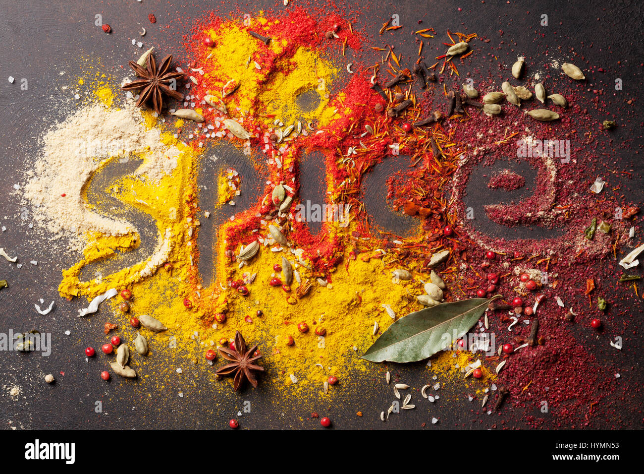 Word Spice drawing on various spices on stone table. Top view Stock ...