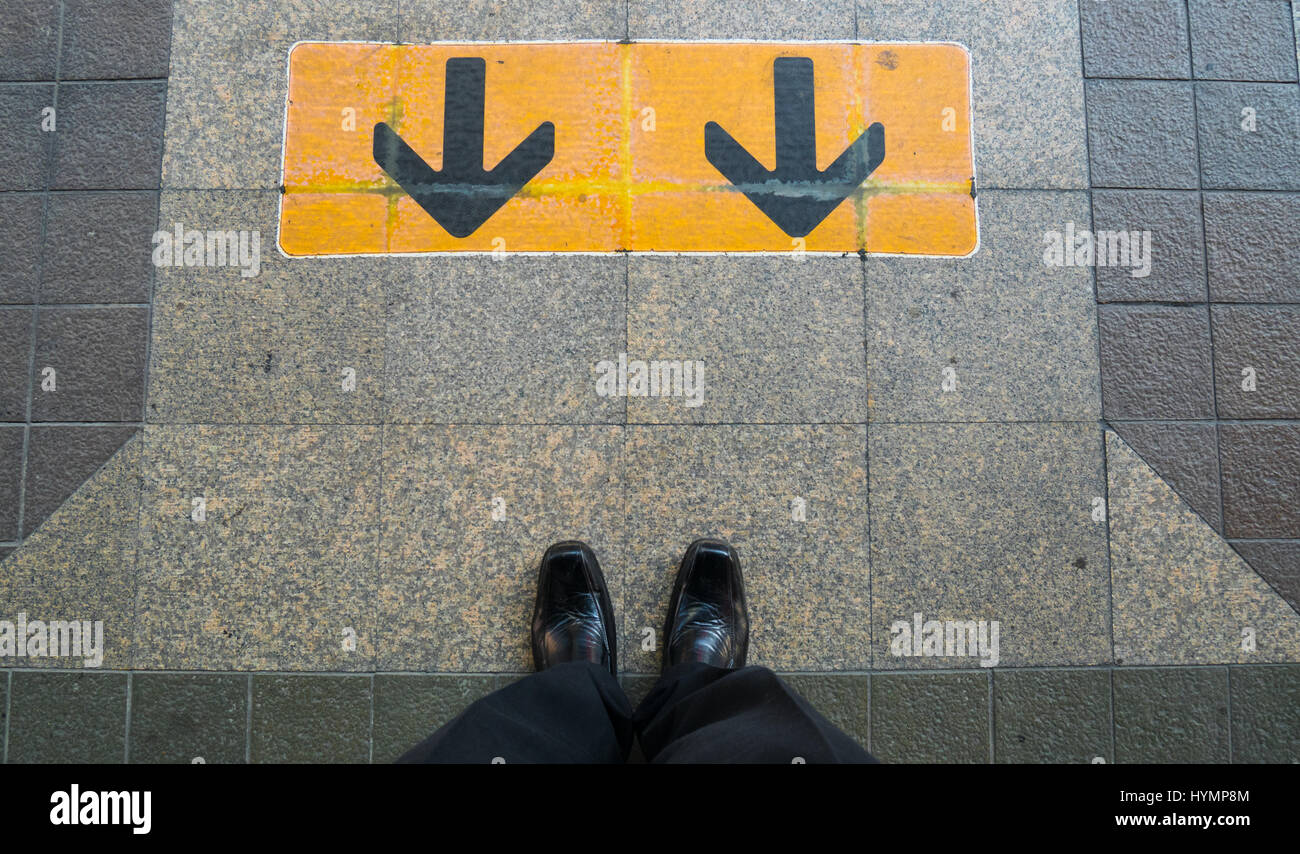 Shoes on yellow line hi-res stock photography and images - Alamy