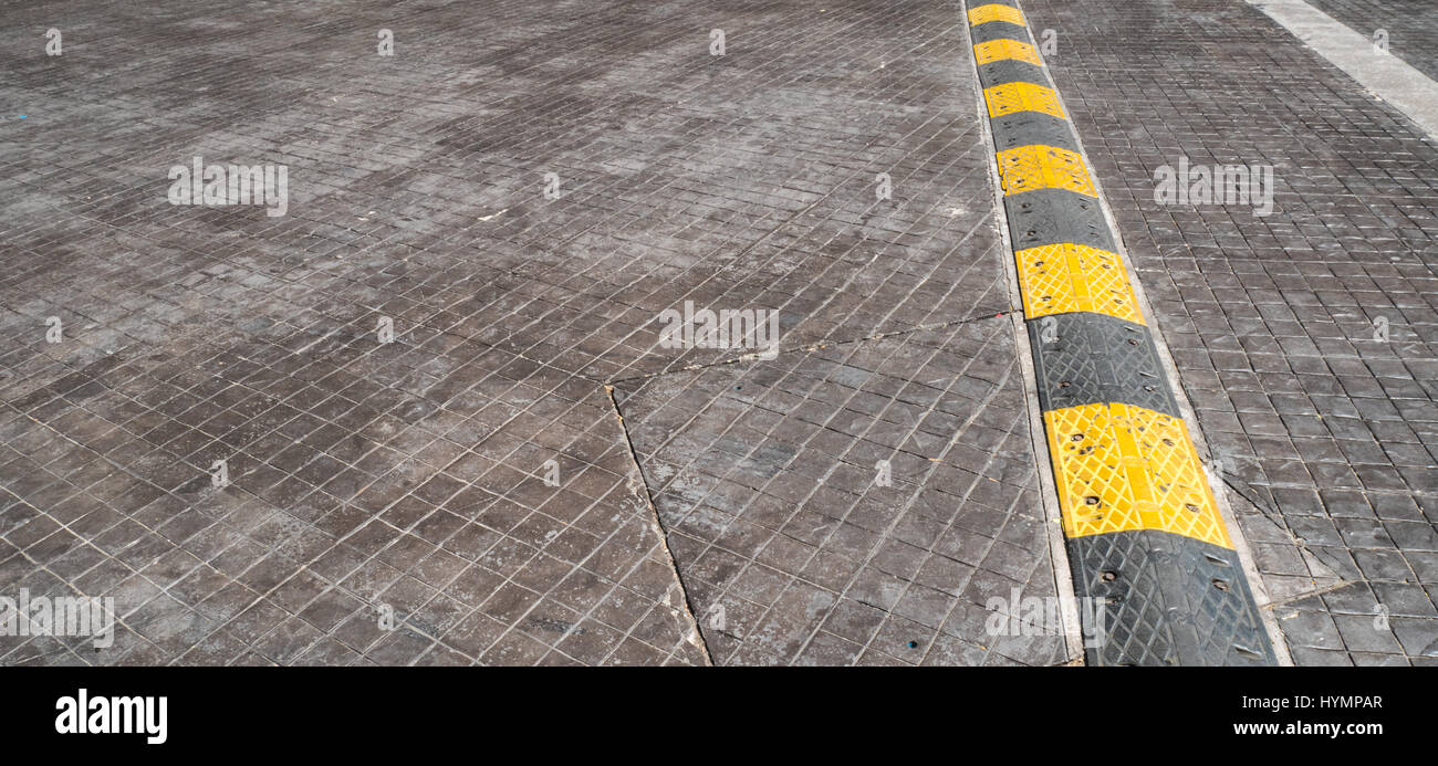 Road bump on the road for reduce speed Stock Photo - Alamy