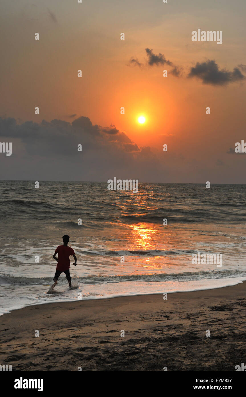 Boy enjoying sunset | Beautiful sunset, Sunset, Most beautiful beach ...