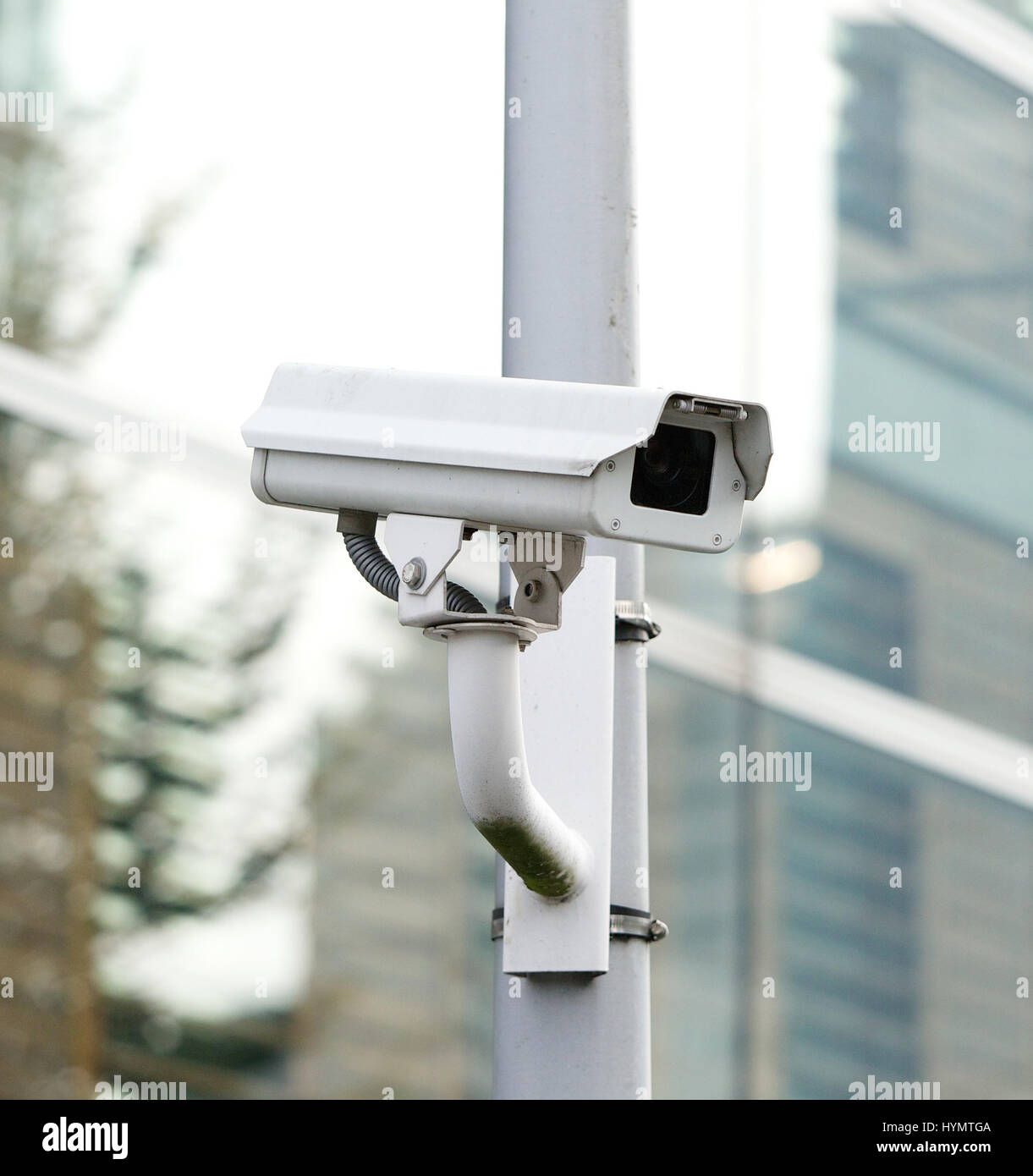 CCTV security camera looking and recording in the city Stock Photo - Alamy