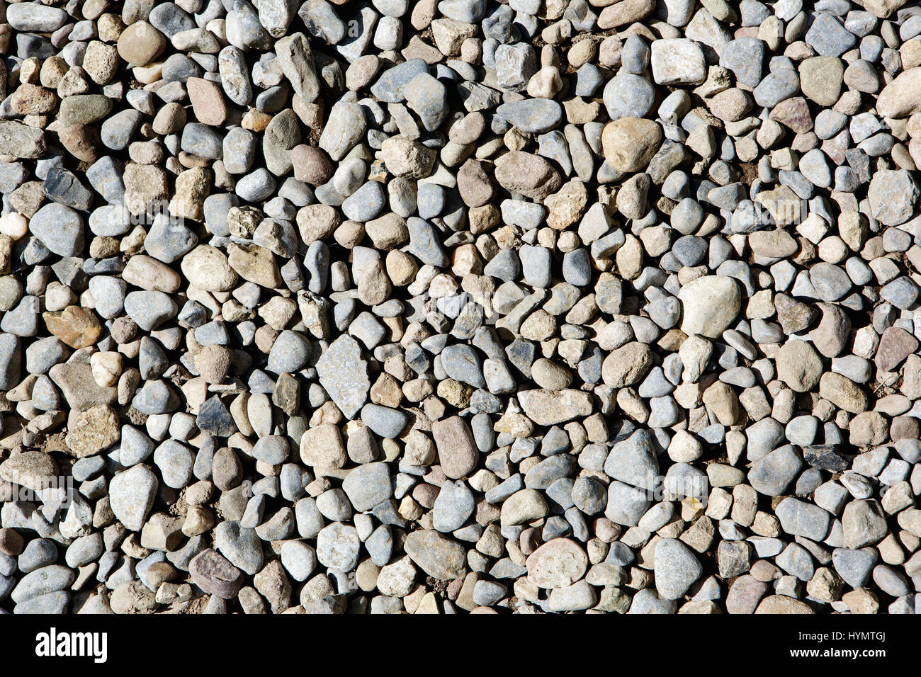 Close up gray pebbles and stones background Stock Photo - Alamy