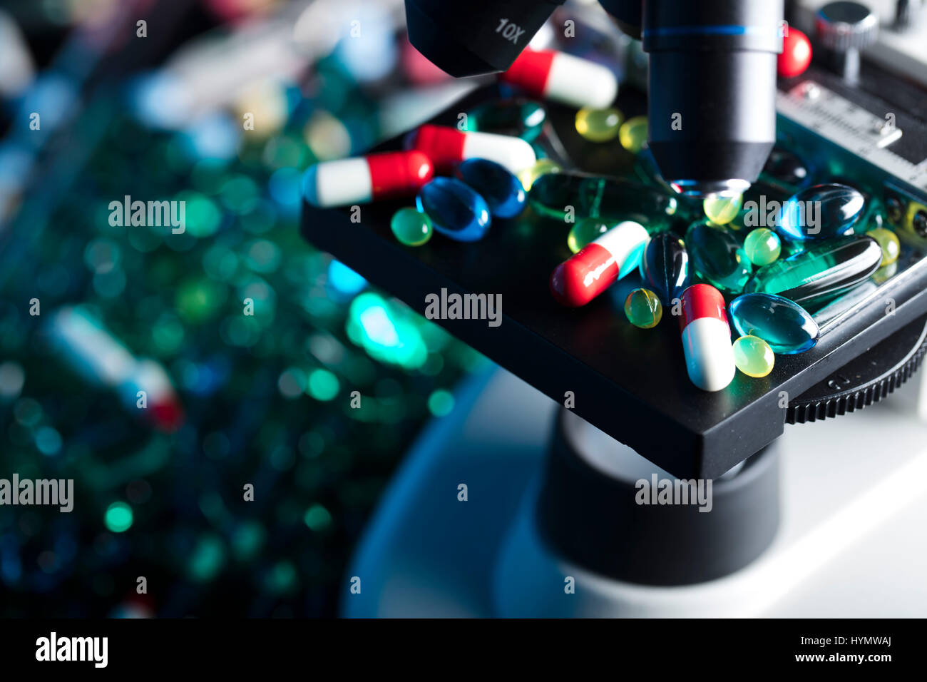Pharmacy theme. Set of different colorful pills. Microscope in ...