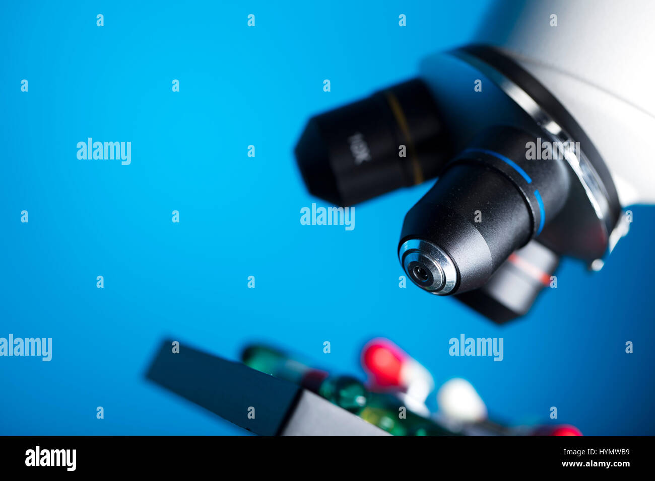 Pharmacy theme. Set of different colorful pills. Microscope in ...