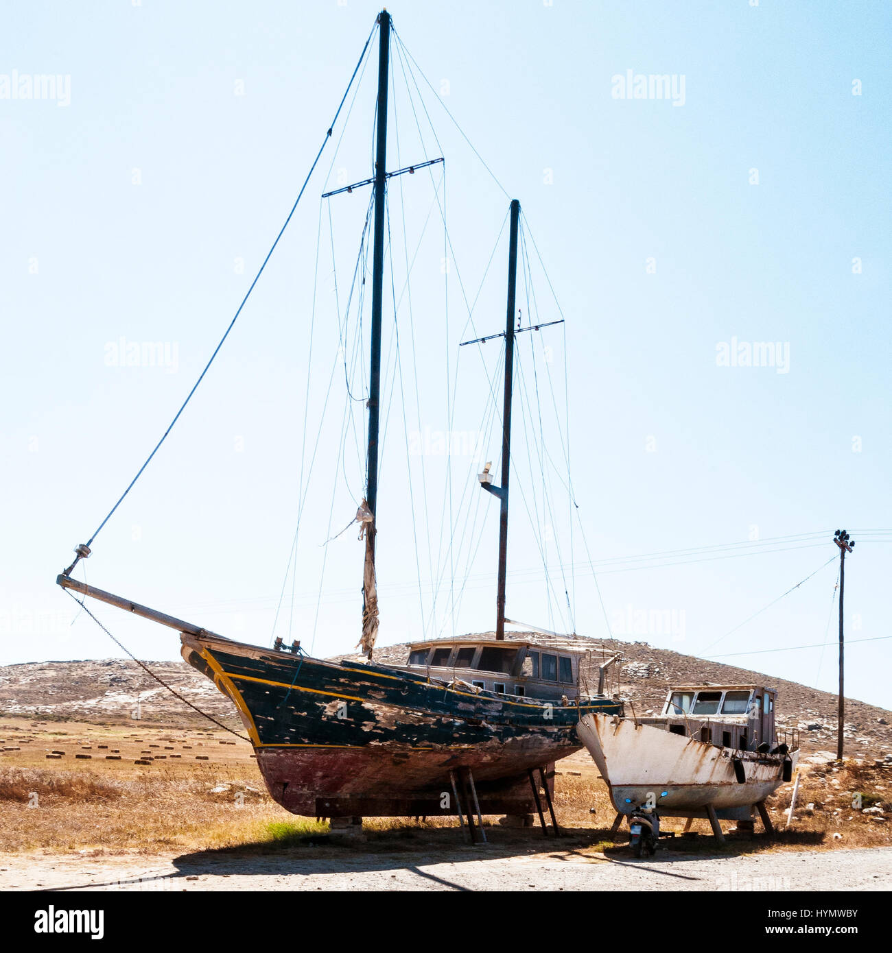Two boats in bad shape ready for renovation parked on the shore of ...