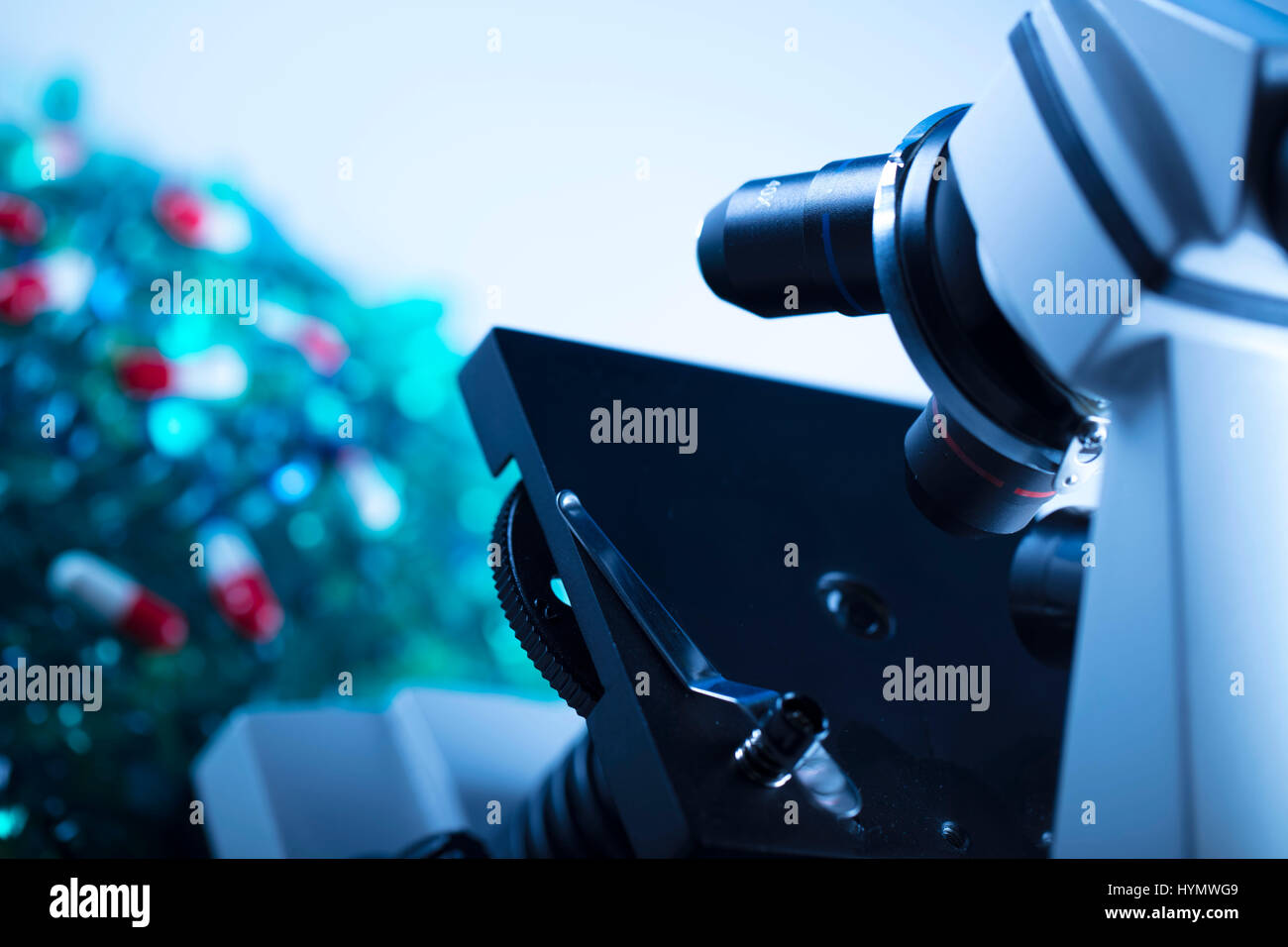 Pharmacy theme. Set of different colorful pills. Microscope in ...