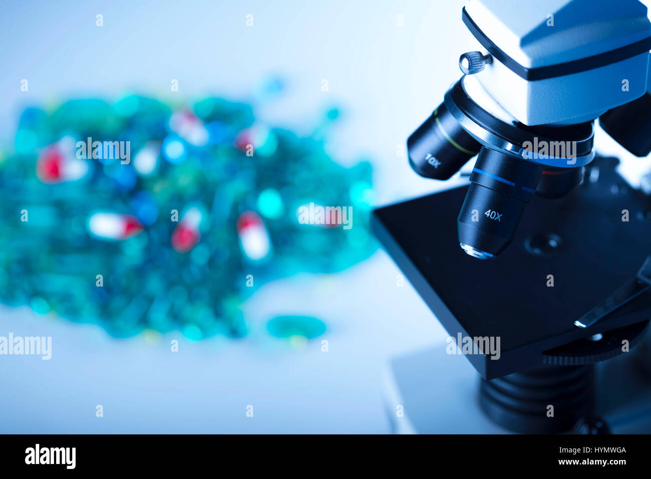 Pharmacy theme. Set of different colorful pills. Microscope in ...