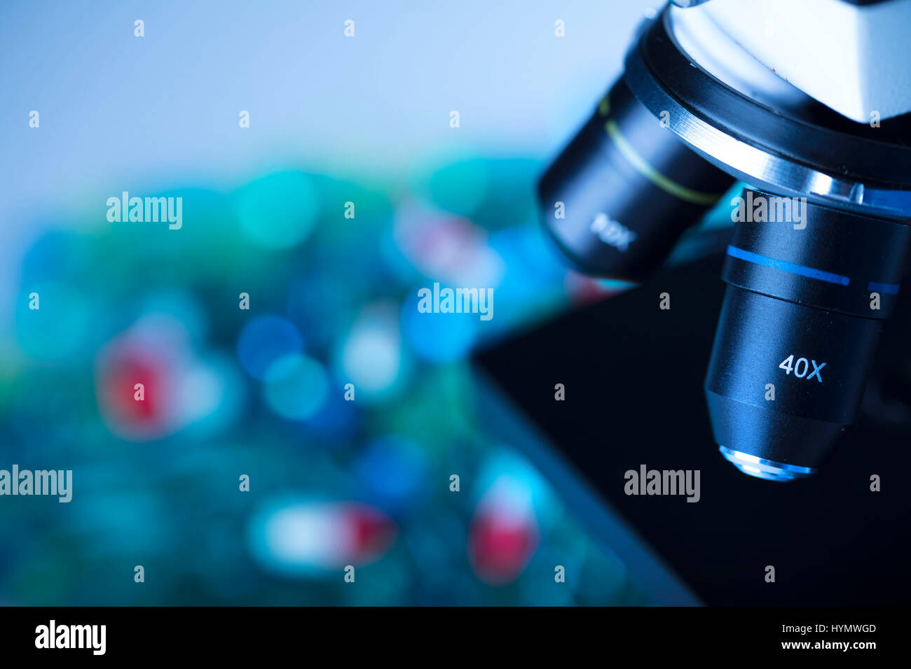 Pharmacy theme. Set of different colorful pills. Microscope in ...