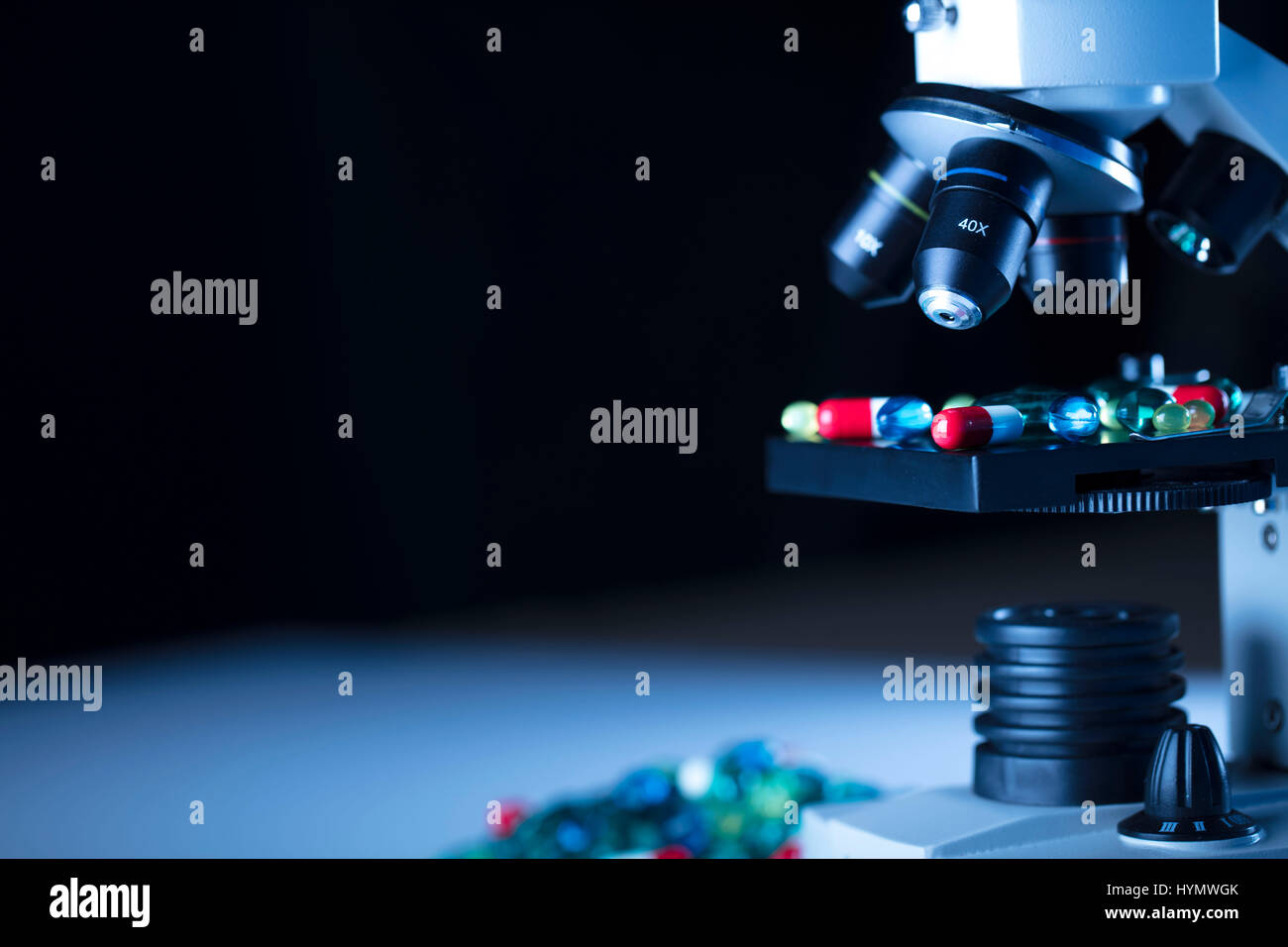 Pharmacy theme. Set of different colorful pills. Microscope in ...
