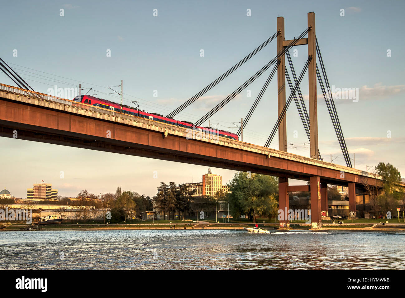 Belgrade, Serbia - Passenger train crossing the cable bridge over the ...
