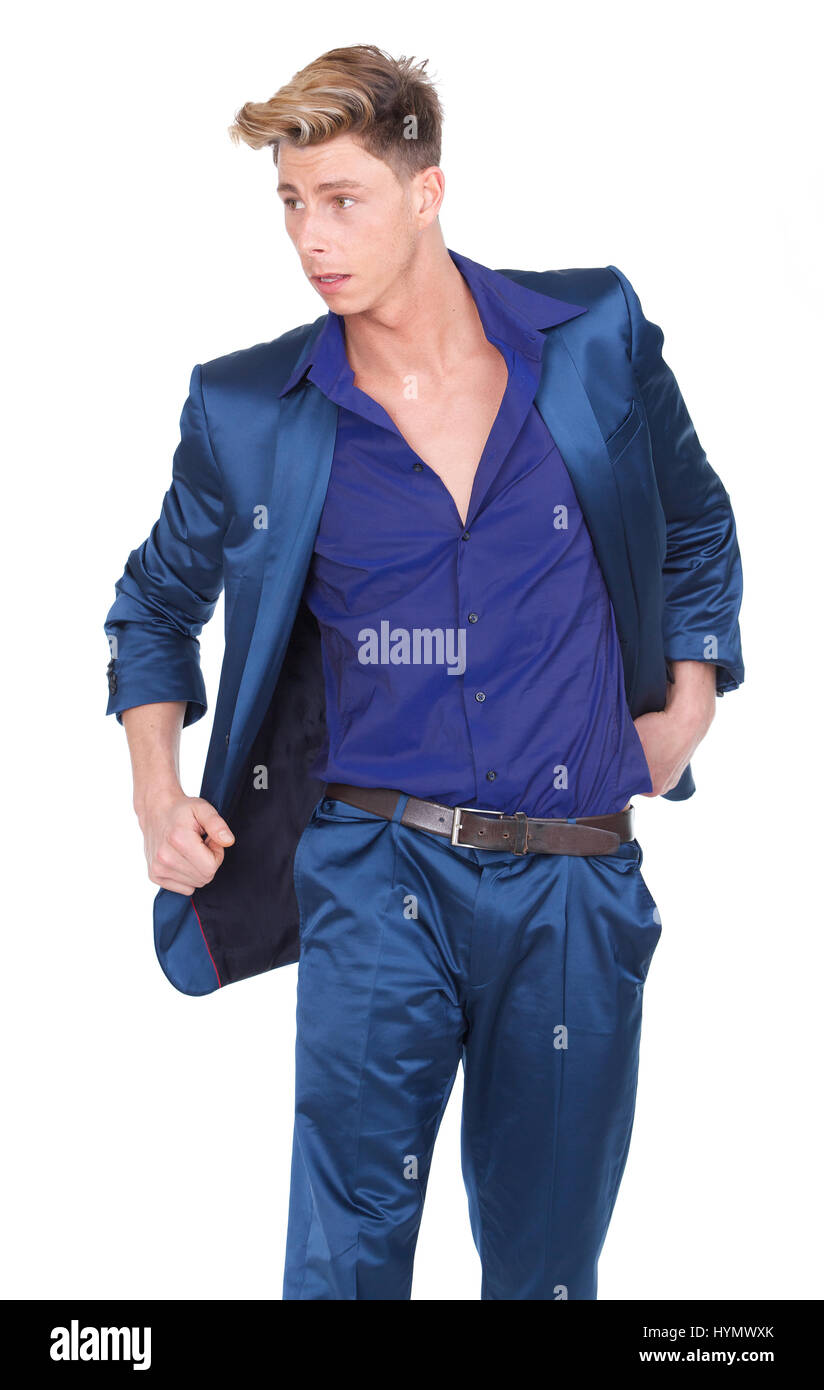 Portrait of a male fashion model posing in blue suit on isolated white ...