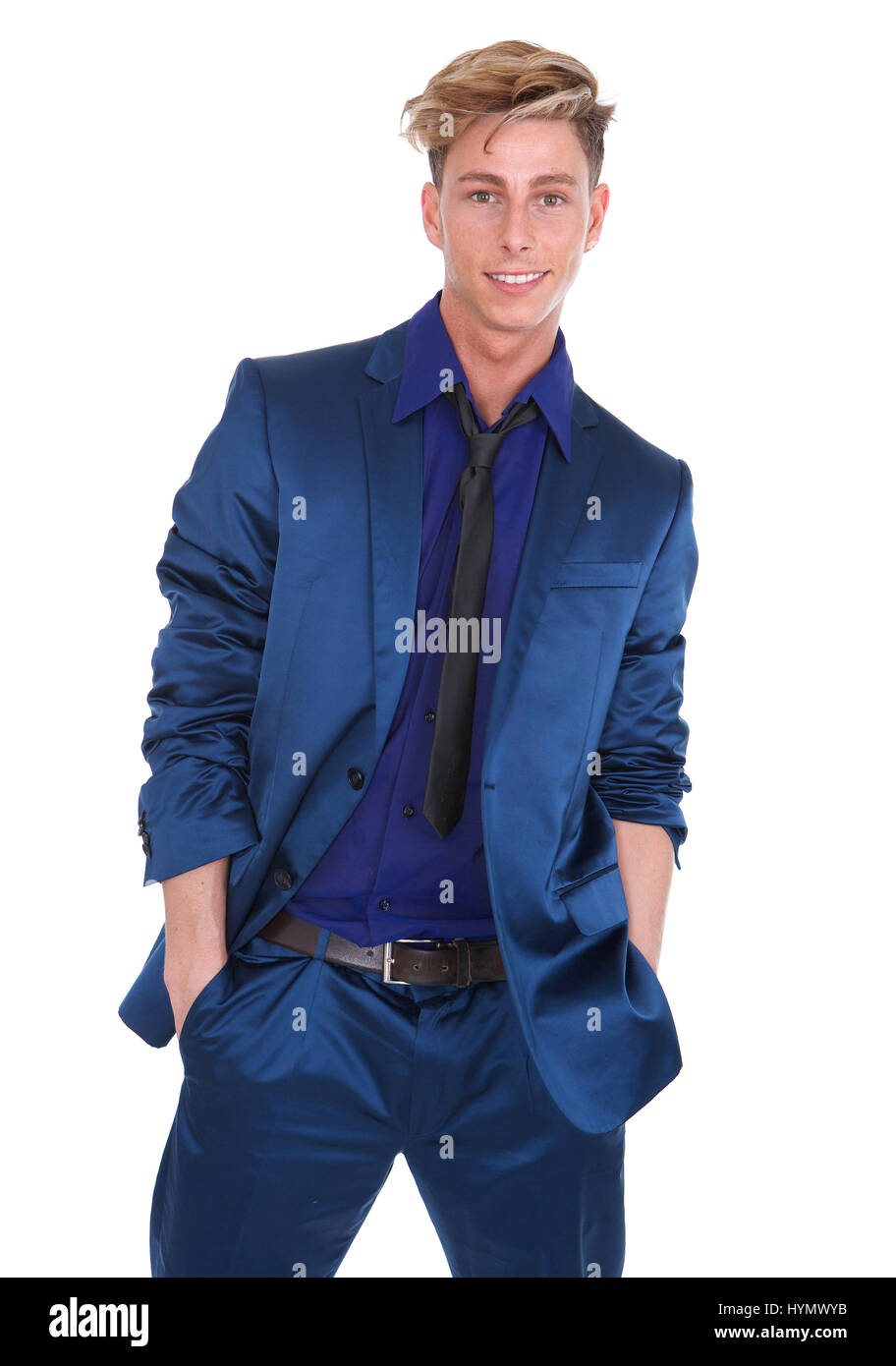 Portrait of a charming young man posing in blue suit on isolated white ...