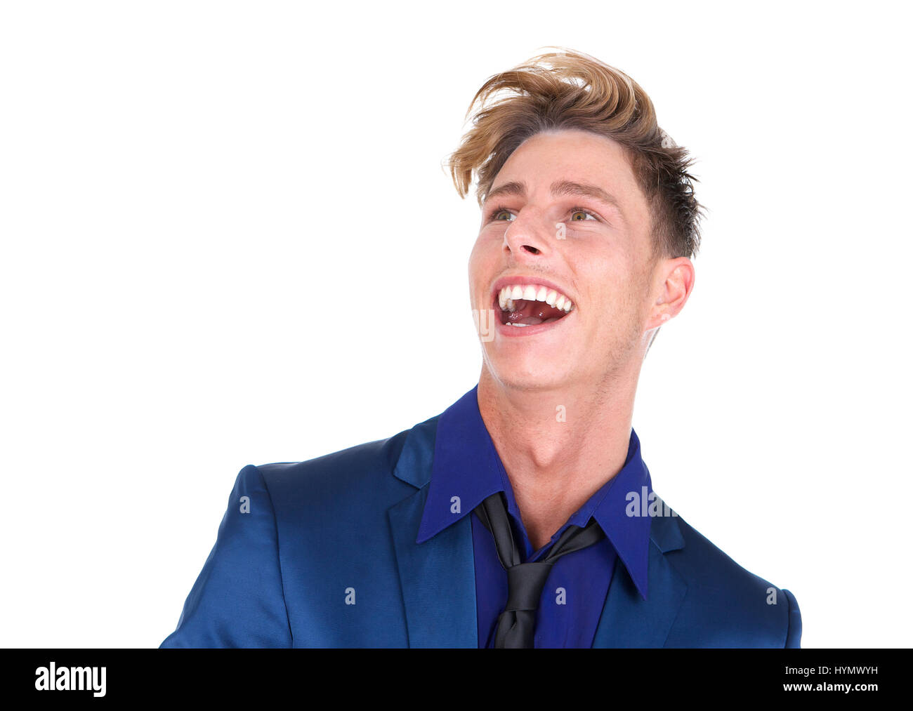 Portrait of a young man laughing and looking up on isolated white ...