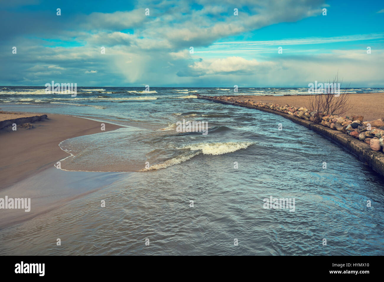 Delta river in the daytime. The river flows into the sea Stock Photo ...