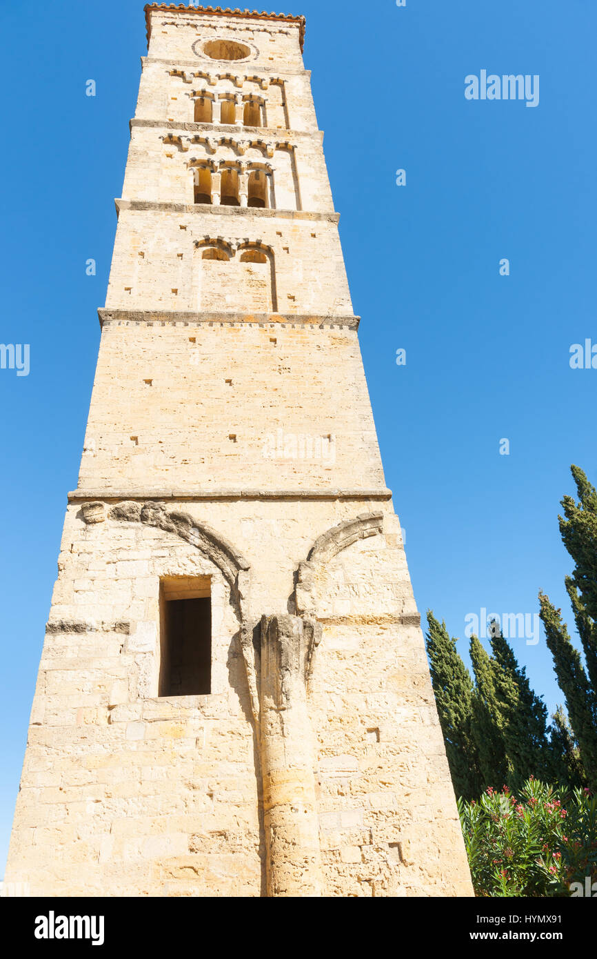 Tall brick tower typically Mediterranean style with cypress trees Stock ...