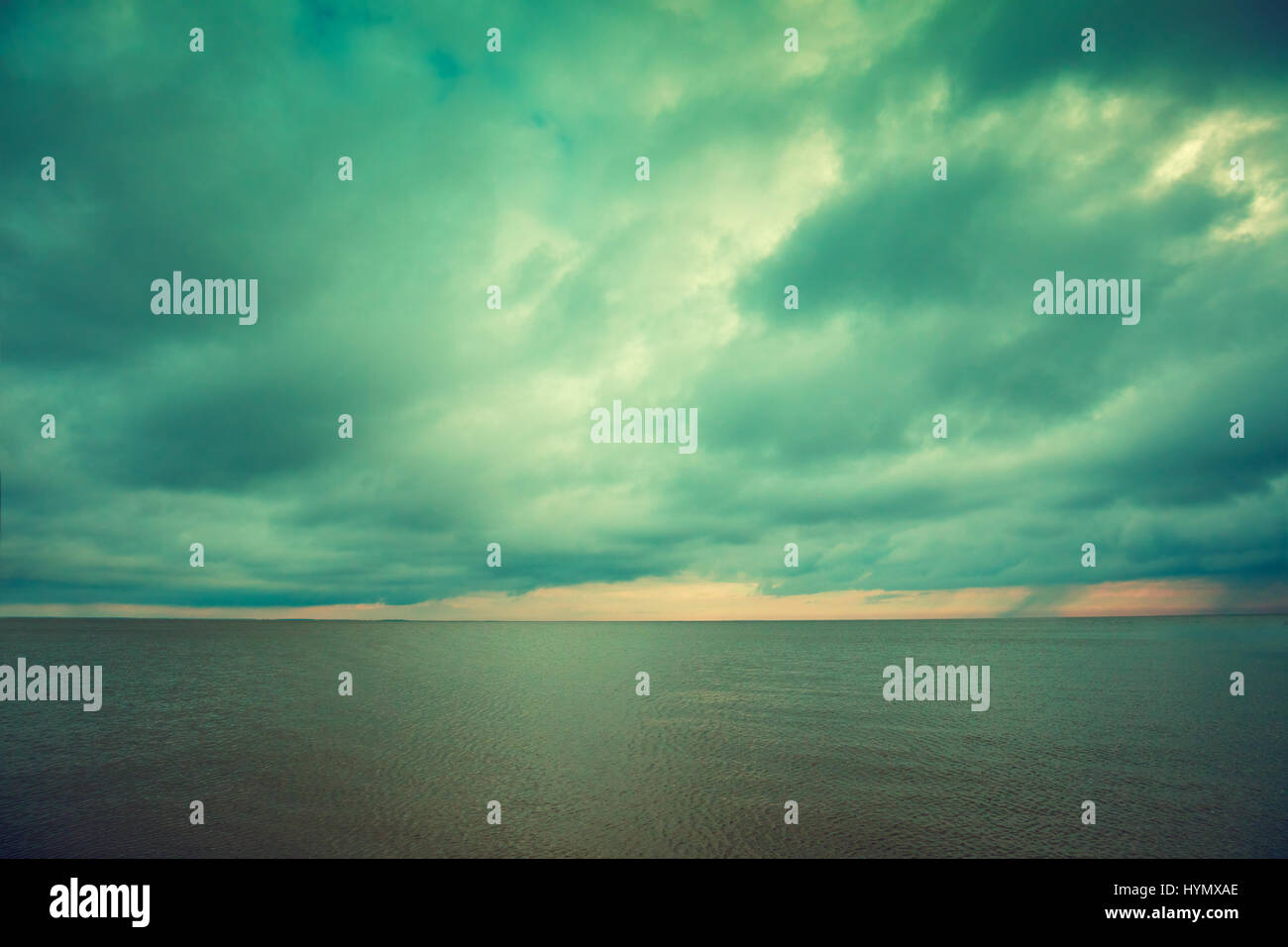 quiet calm sea with the cloudy sky at sunset Stock Photo - Alamy