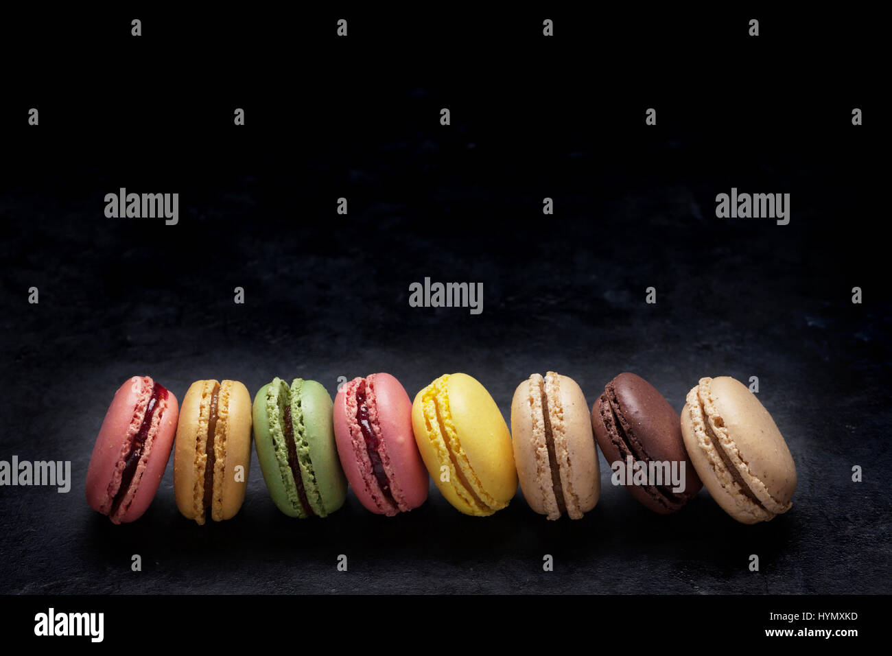 Colorful macaroons on stone table. Sweet macarons. View with copy space ...