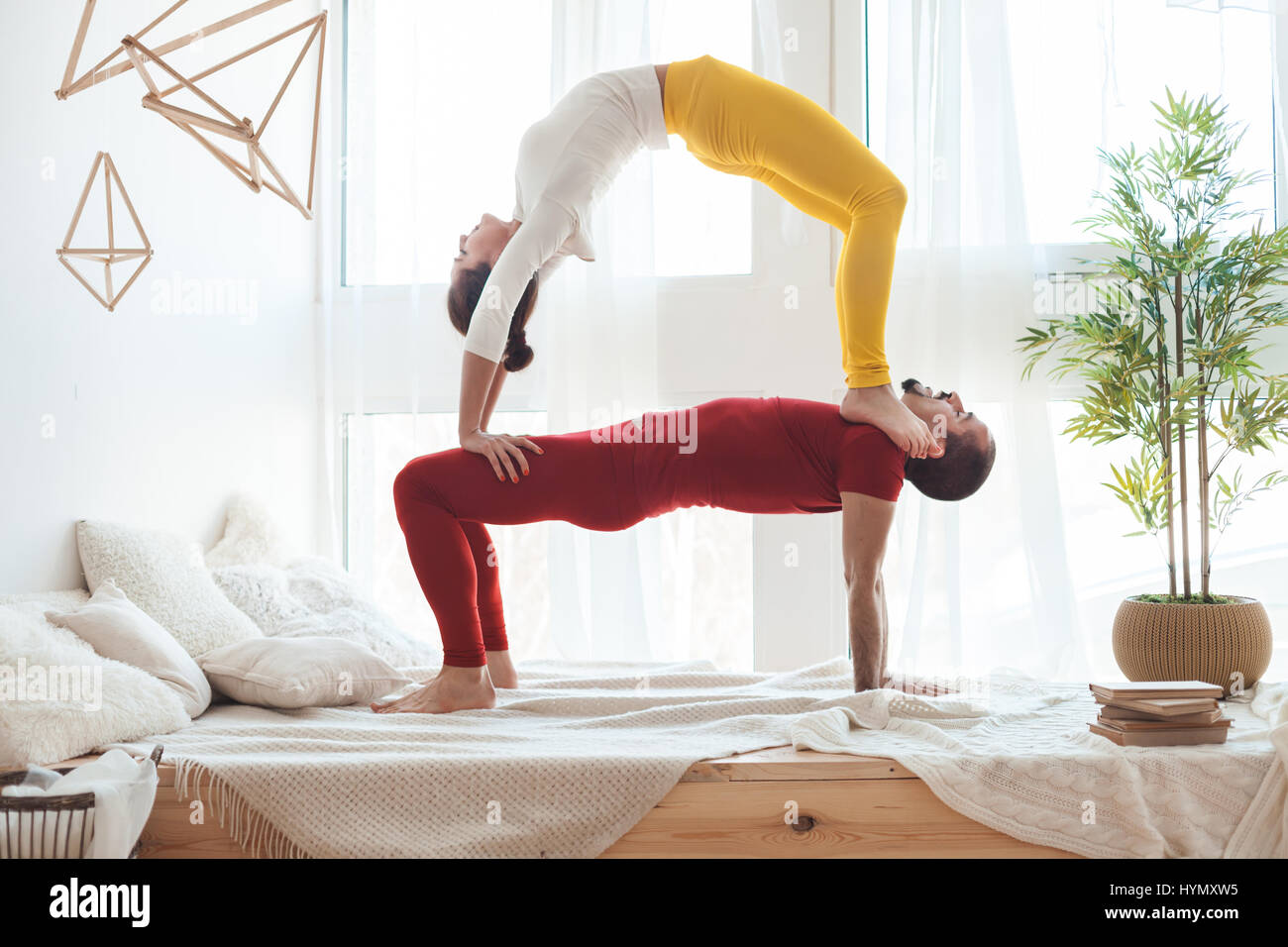 Sports married couple doing gymnastics in the morning Stock Photo - Alamy