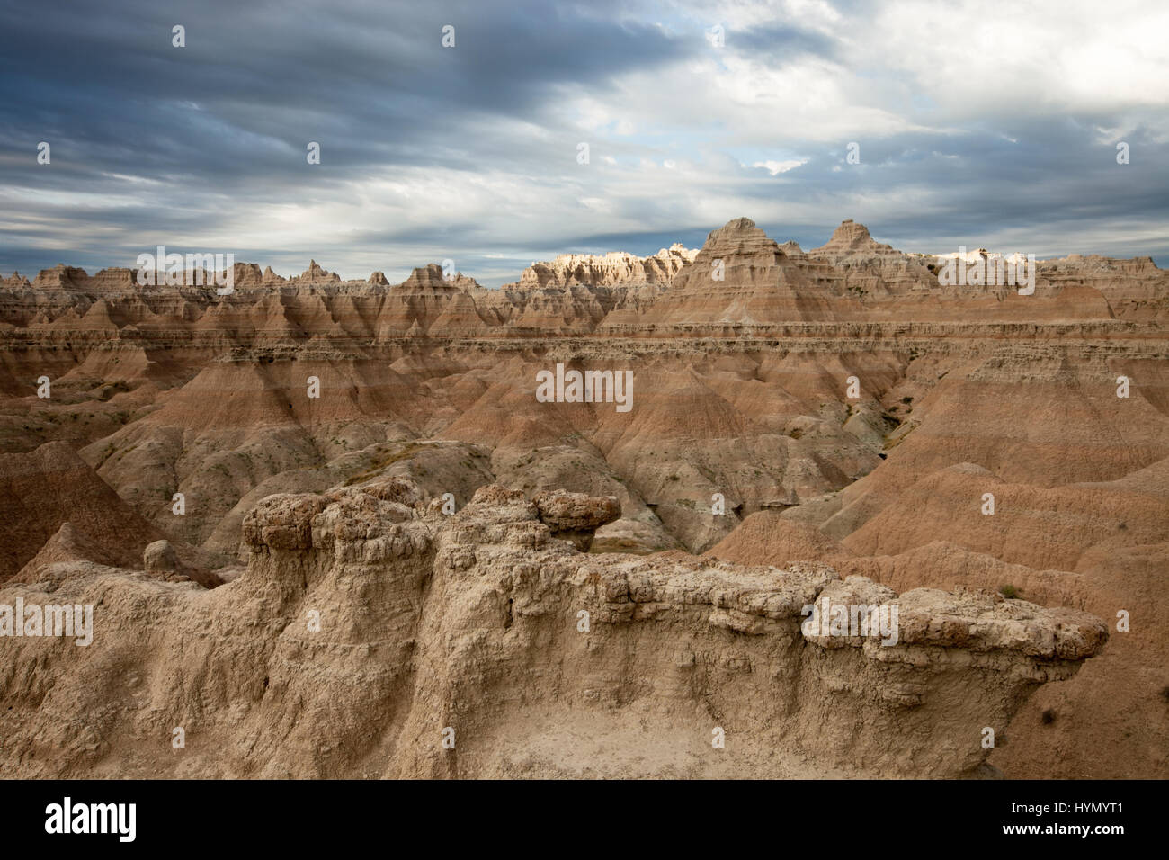 The sun illuminates buttes throughout Badlands National Park Stock ...