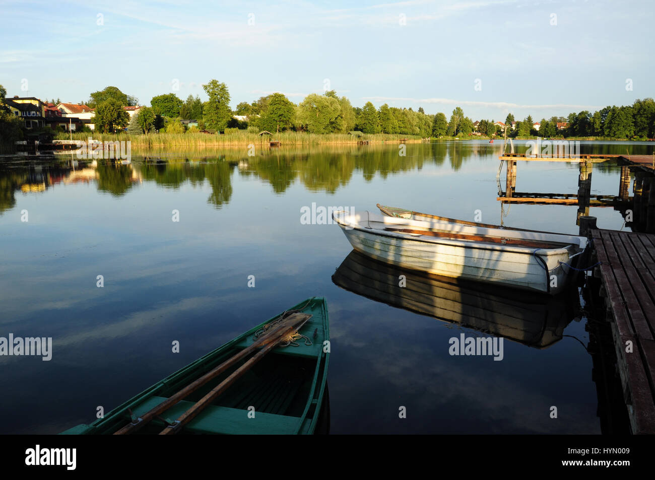 Beautiful summer scene with lake, boats and forest in countryside at ...