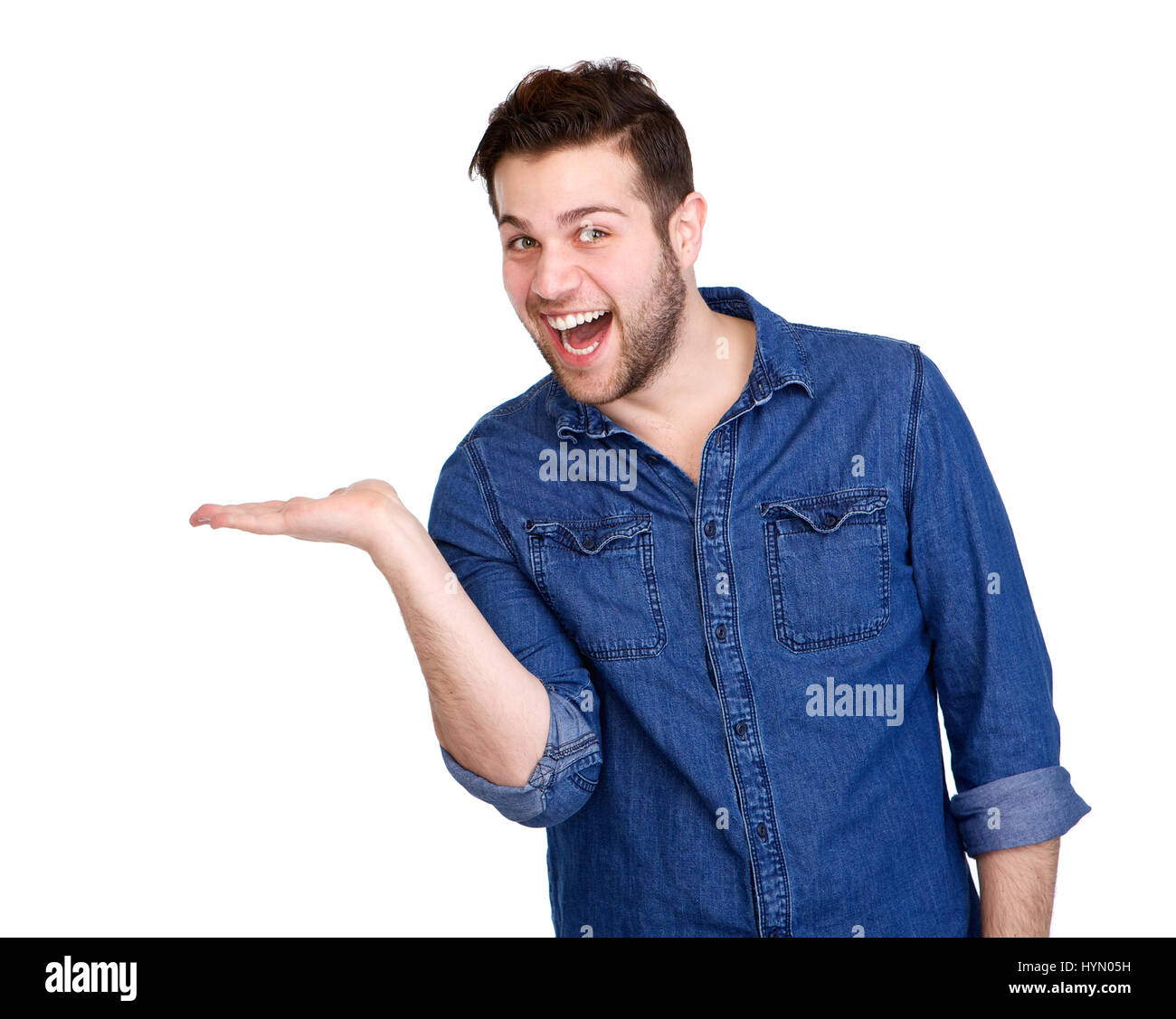 Close up portrait of a smiling man showing hand as display isolated on ...