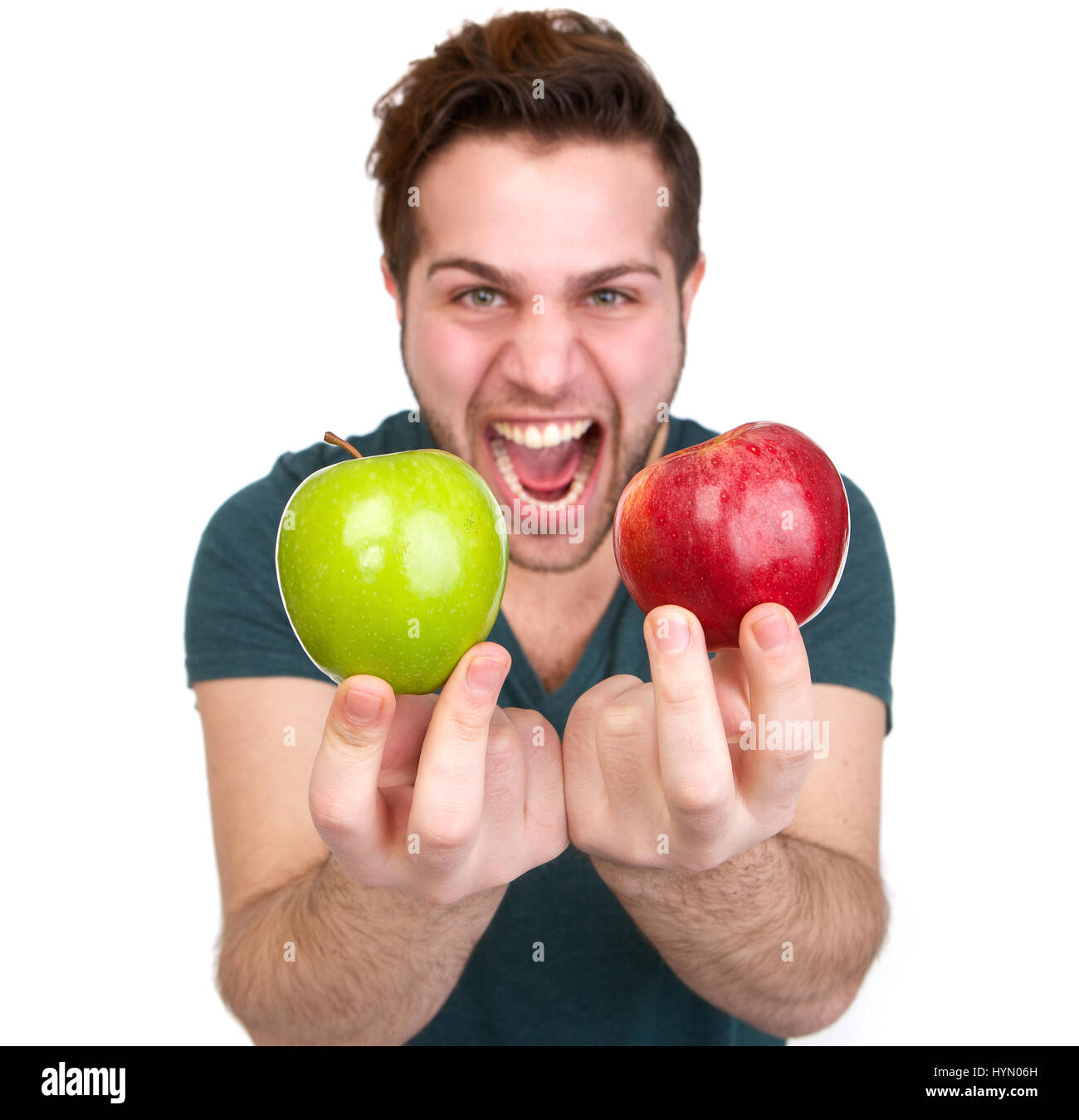 Close up portrait of a happy young man with two apples isolated on ...
