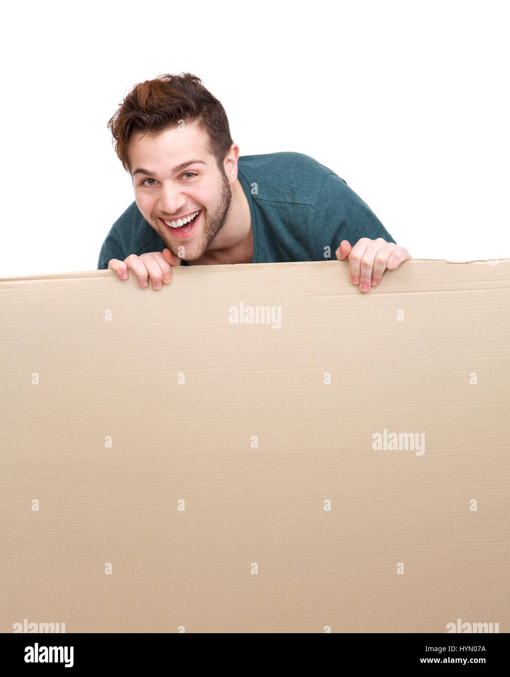 Portrait of a young man laughing and holding blank poster Stock Photo ...