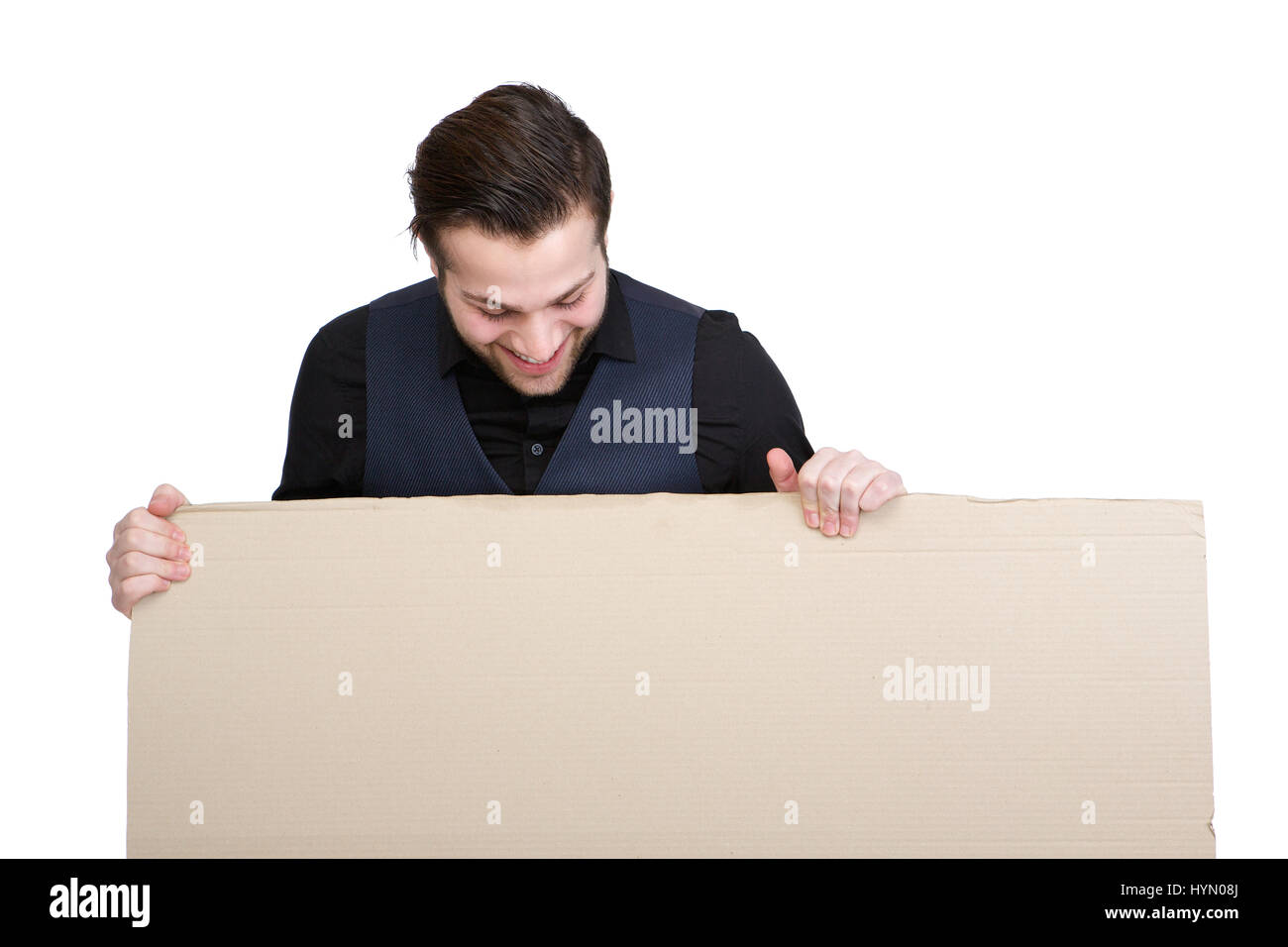Portrait of a young man looking down on blank poster sign Stock Photo ...