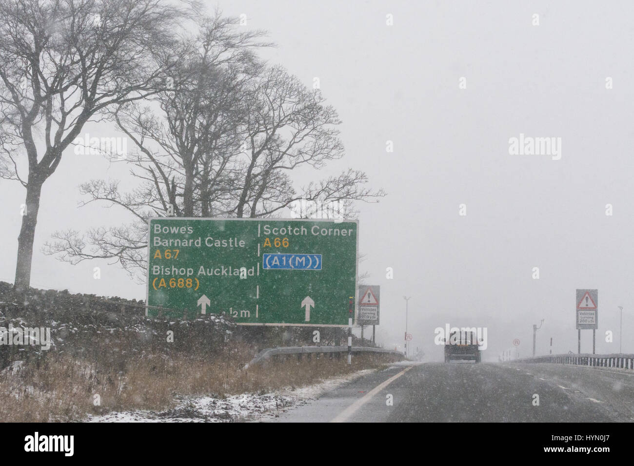 Scotch Corner A66 A1(M) sign in snow heading south Stock Photo - Alamy