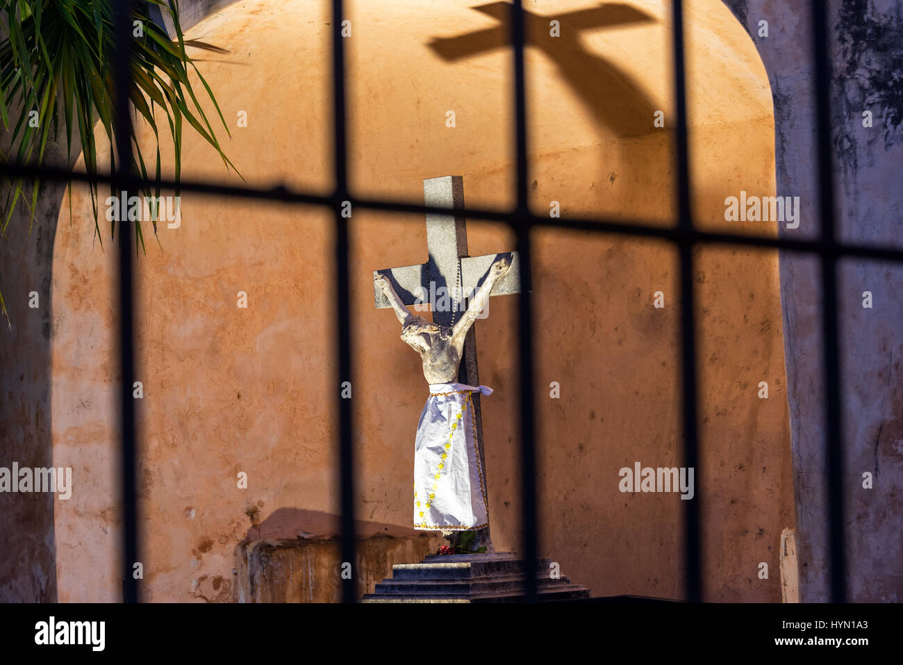 Statue of Jesus at night with a long shadow in Valladolid, Mexico Stock ...