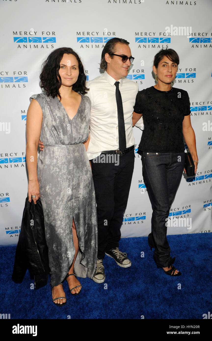 (L-R) Rain Phoenix, Joaquin Phoenix and Summer Phoenix attend the Mercy ...