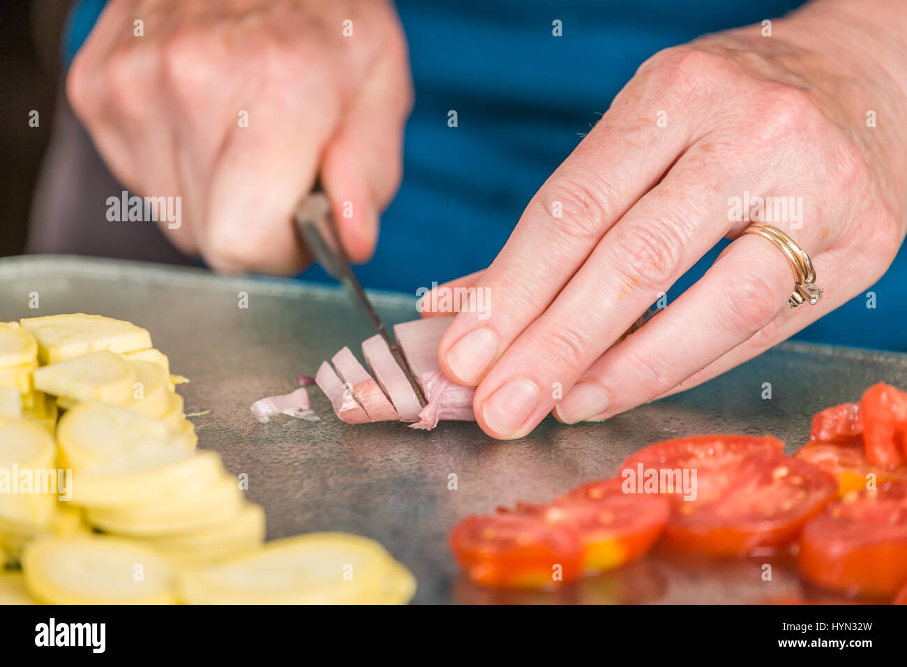 After removing the paper outer covering of the shallot, place it on a ...