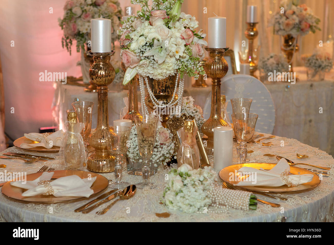 Luxurious wedding dinner with golden theme Stock Photo - Alamy