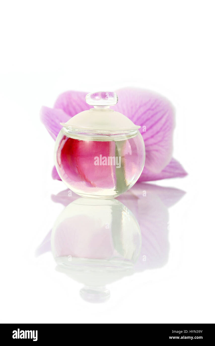Perfume bottle and orchid flower, isolated on white Stock Photo - Alamy