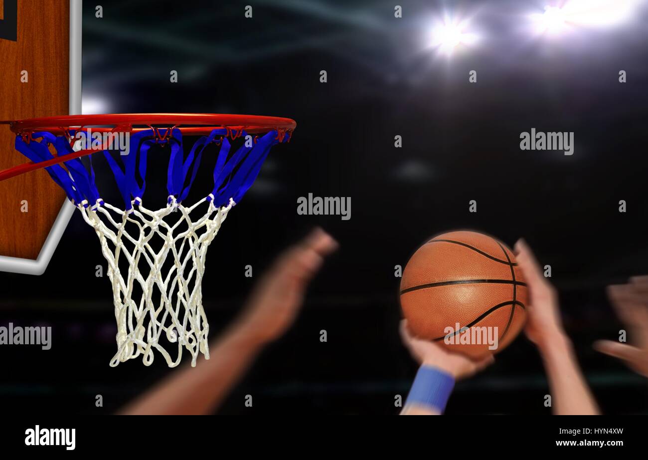 Basketball jump shot to the hoop by player Stock Photo - Alamy